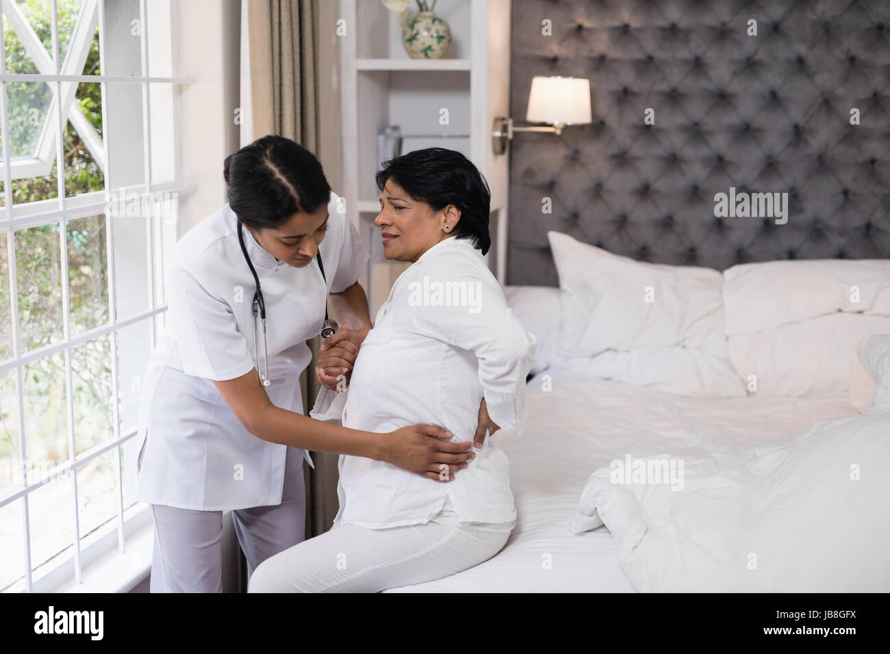 Indian nurse helping patient hi-res stock photography and images - Alamy