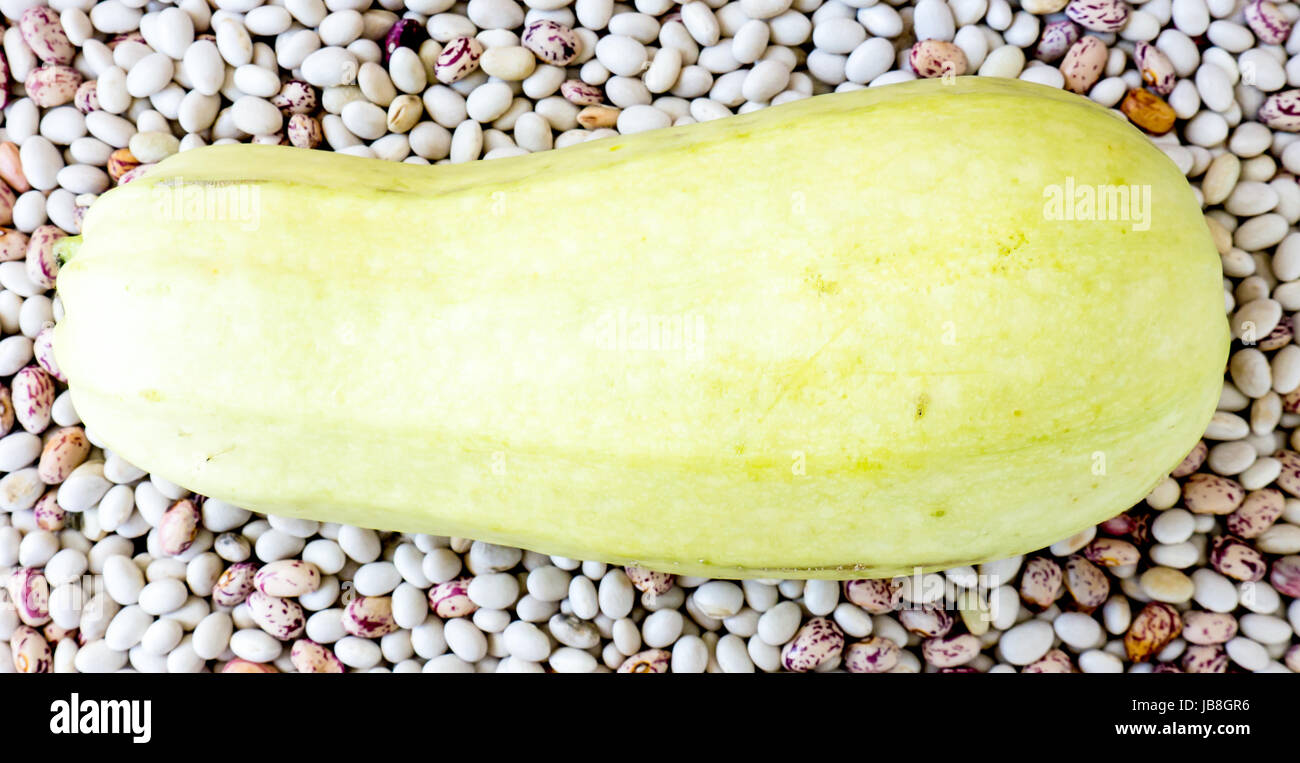 The nature raw squash object on a beans background Stock Photo - Alamy
