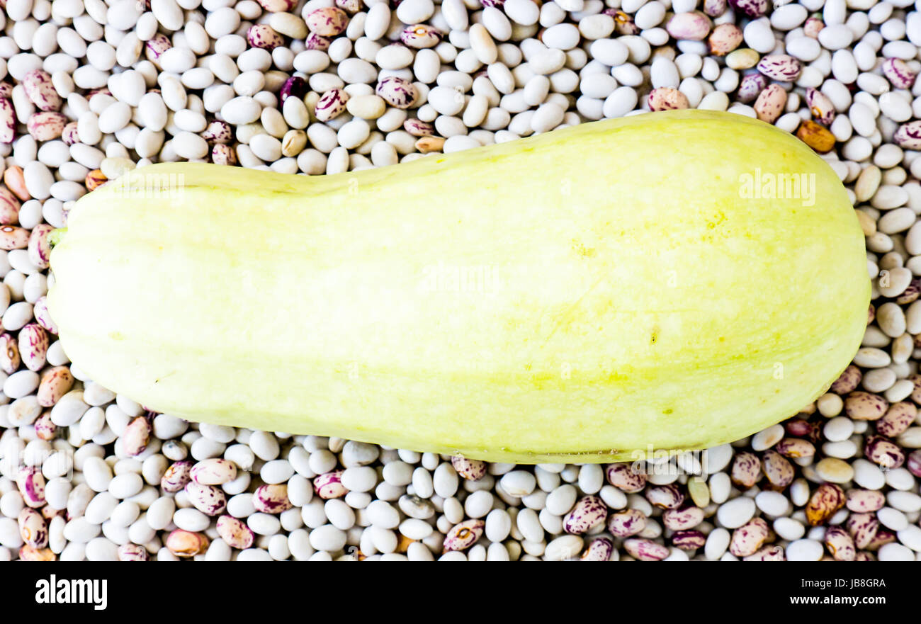 The nature raw squash object on a beans background Stock Photo - Alamy