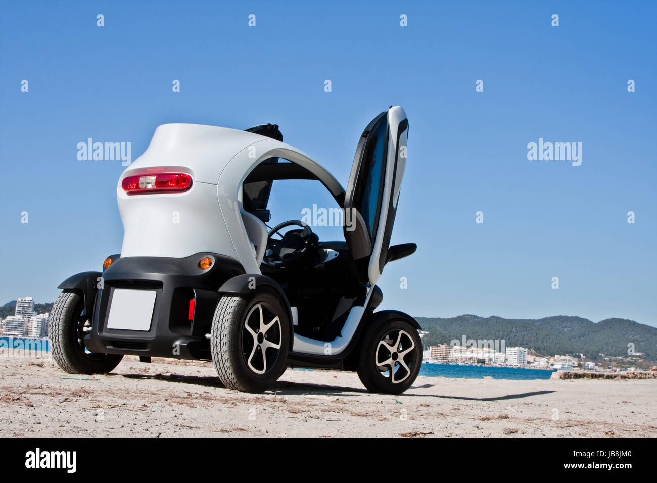 Electric car and beach background Stock Photo - Alamy