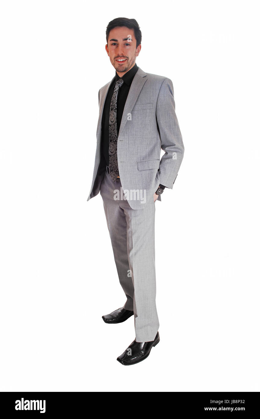 A tall handsome businessman standing for white background in a gray ...
