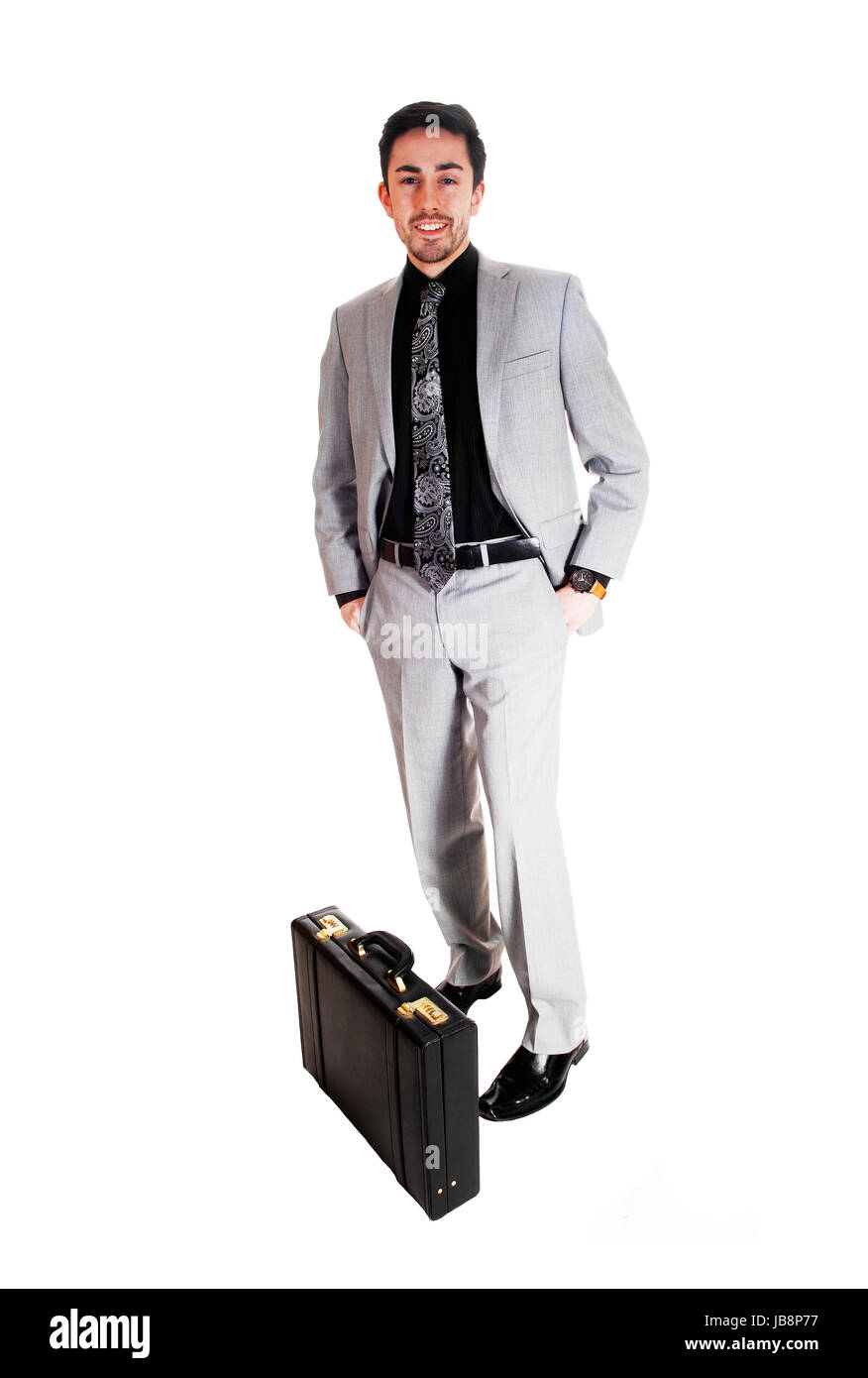 A tall handsome businessman standing for white background in a gray ...