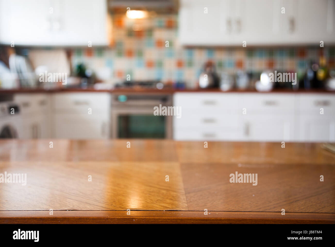 blurred kitchen interior and napkin and desk space Stock Photo - Alamy