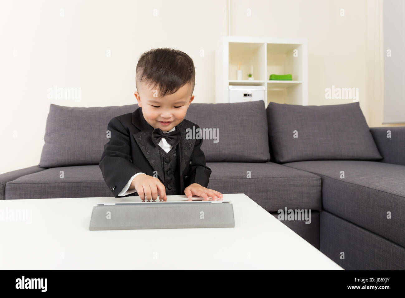 Little boy using digital tablet Stock Photo - Alamy