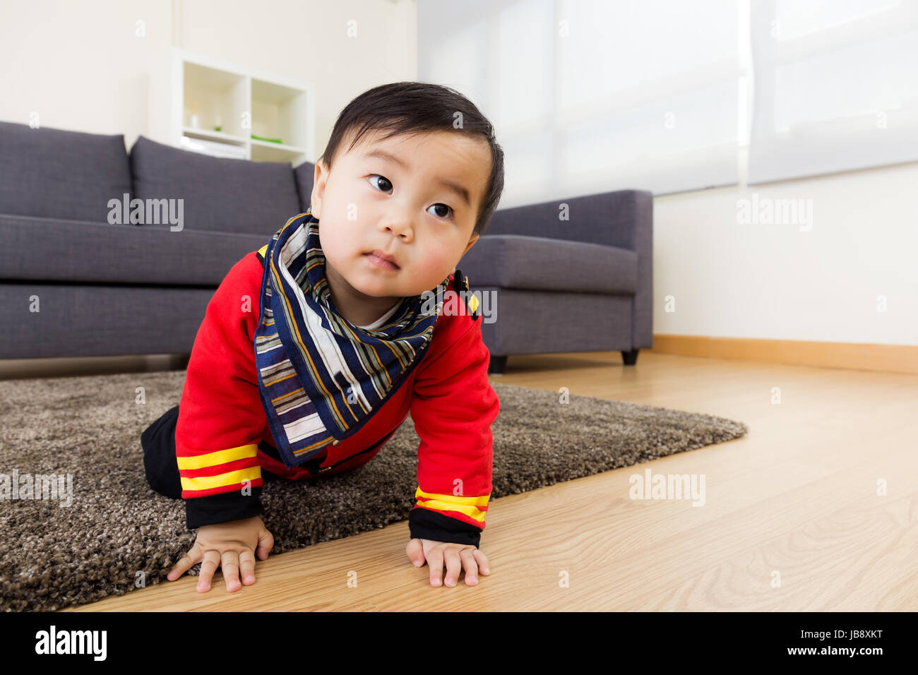 Asian baby boy creeping on floor Stock Photo - Alamy