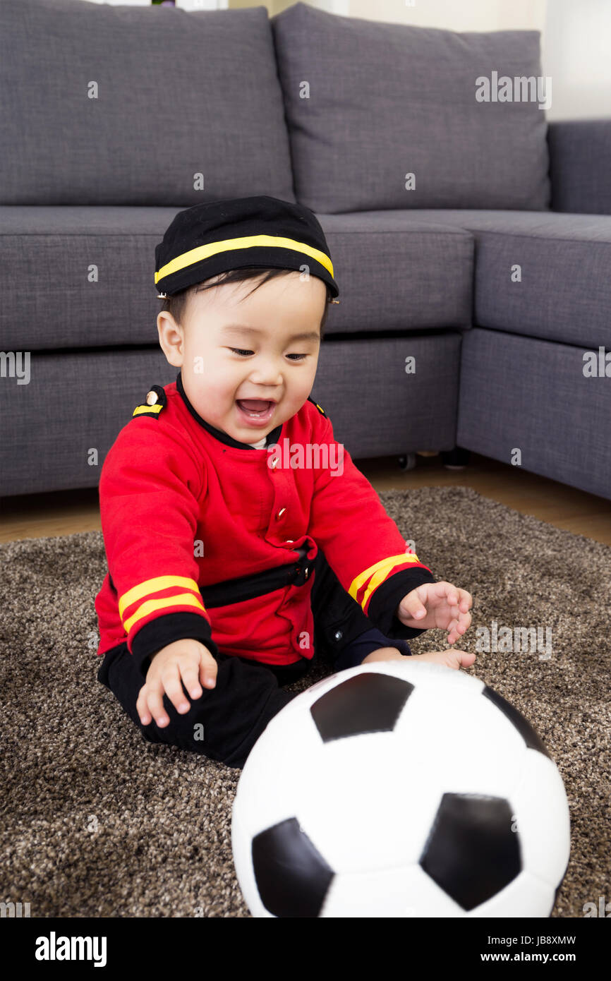 Little baby playing with football Stock Photo - Alamy