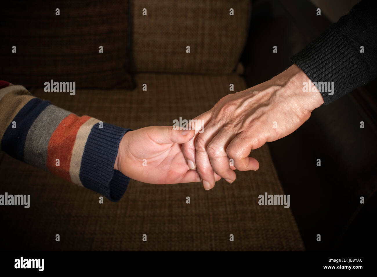 Two hands caught. Adult and child hand Stock Photo - Alamy