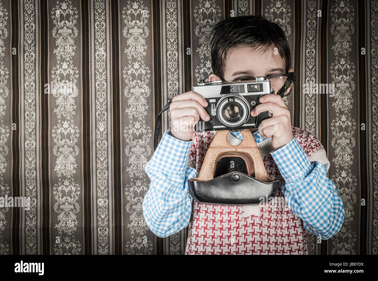 Boy with vintage camera. Vintage clothes Stock Photo - Alamy