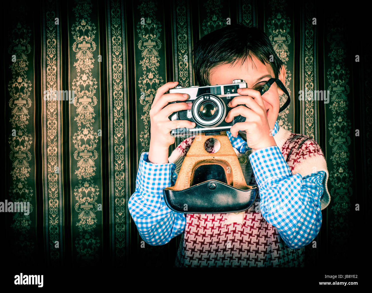 Boy with vintage camera. Vintage clothes Stock Photo - Alamy