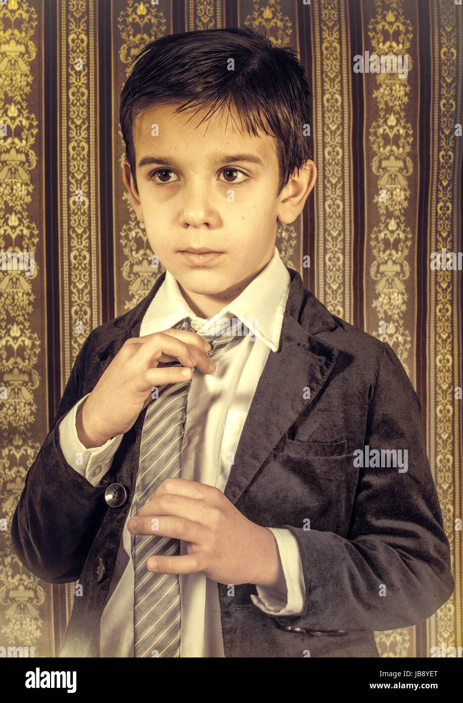 Boy in vintage black suit and tie Stock Photo - Alamy