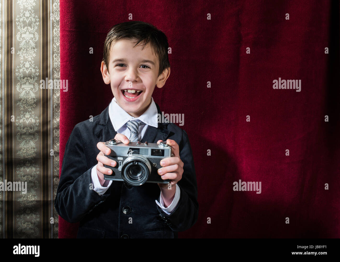 Boy with vintage camera. Vintage clothes Stock Photo - Alamy