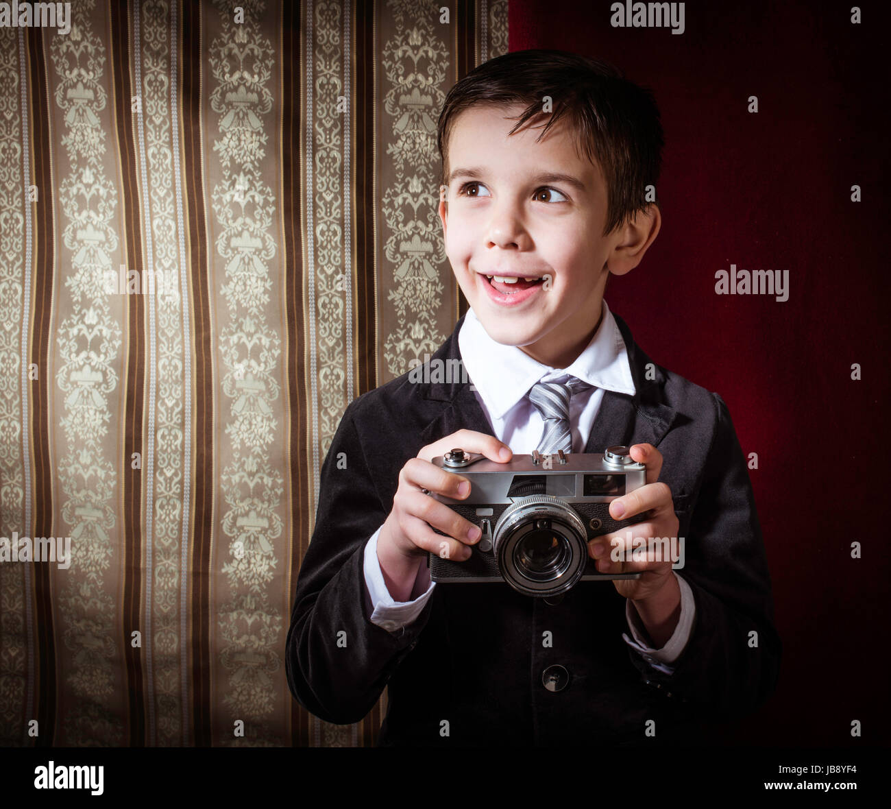 Boy with vintage camera. Vintage clothes Stock Photo - Alamy