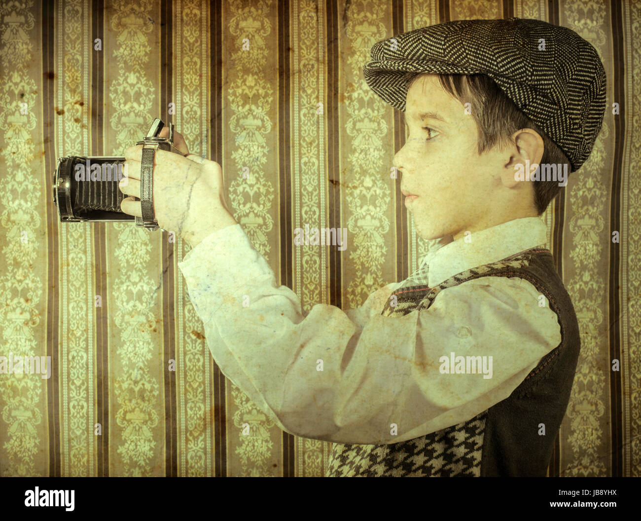 Boy with vintage camera. Vintage clothes Stock Photo - Alamy