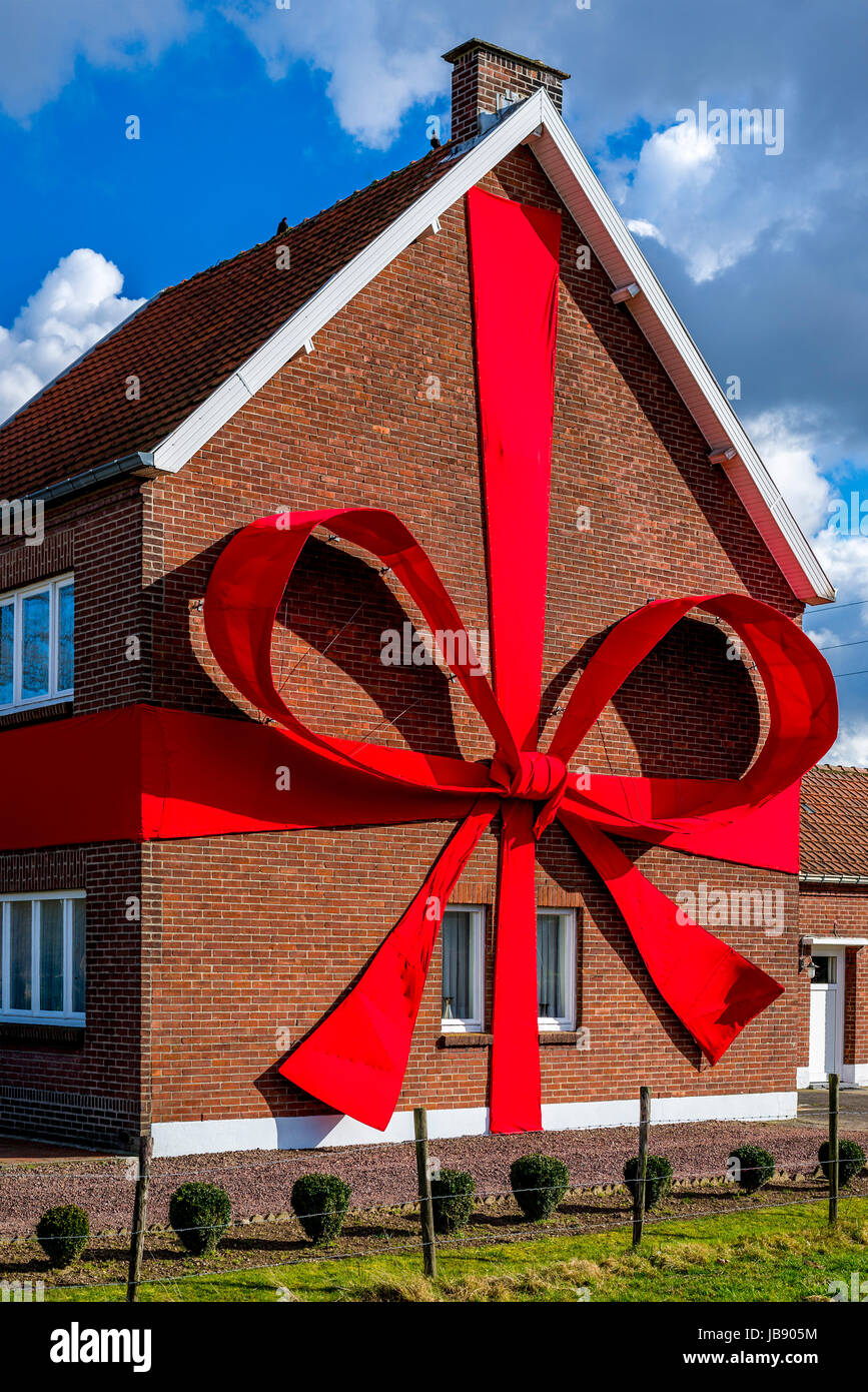 home packed like a present, with a red ribbon strapped around it Stock ...