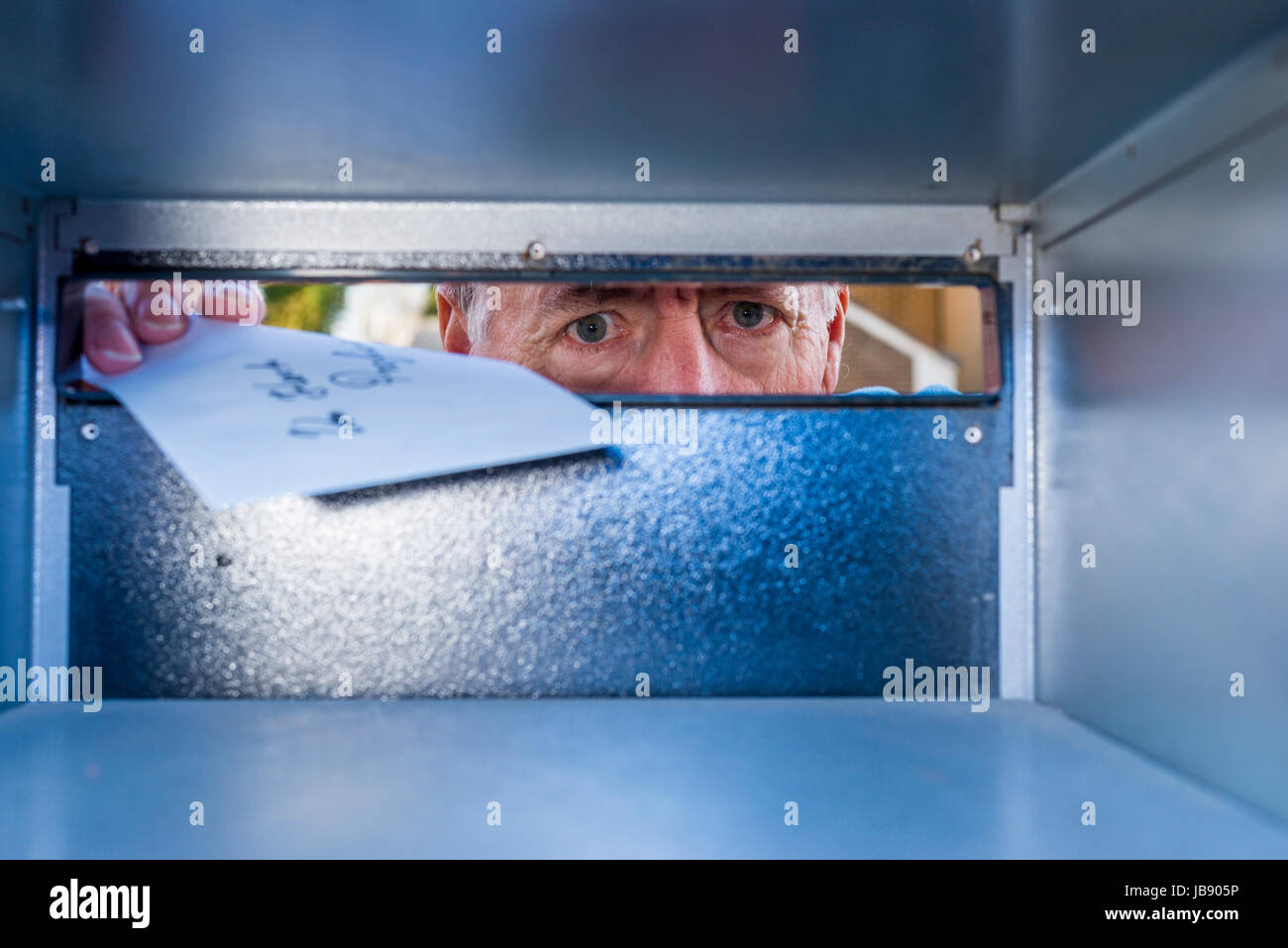 inside view of a mail box, with a man delivering mail Stock Photo - Alamy