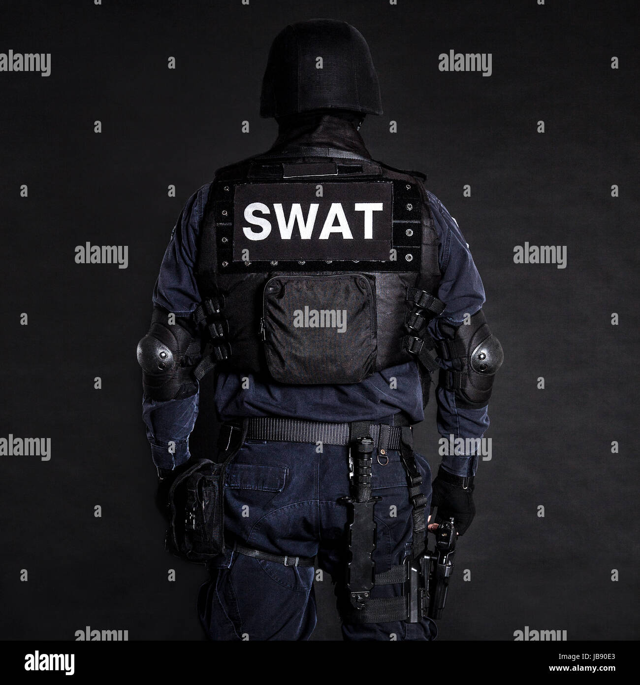 Special weapons and tactics (SWAT) team officer on black background ...