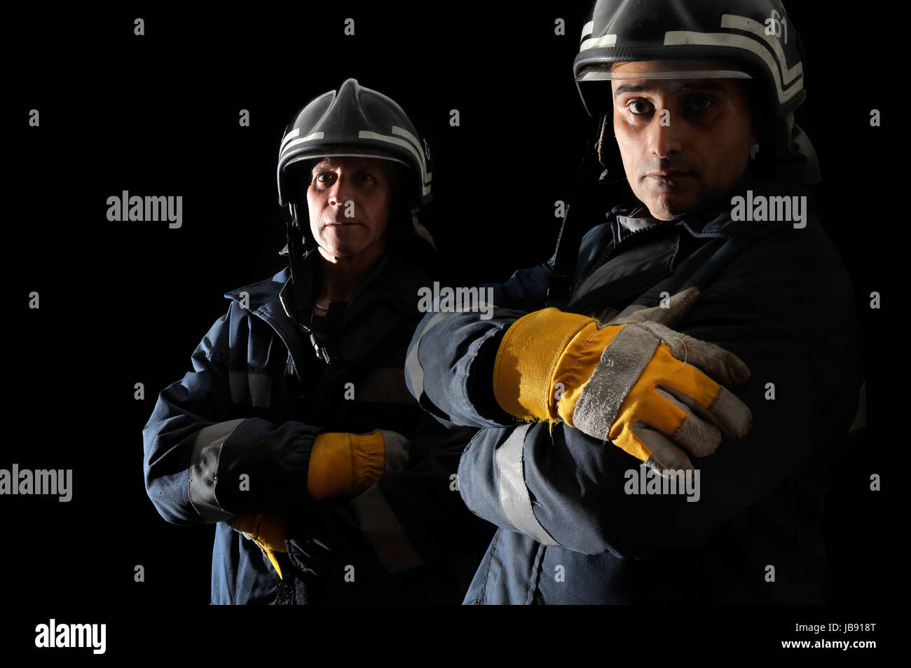Dramatic image of firemen team in uniform Stock Photo - Alamy