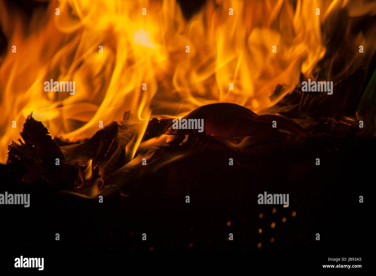 Wood burning flaming red hot Stock Photo - Alamy