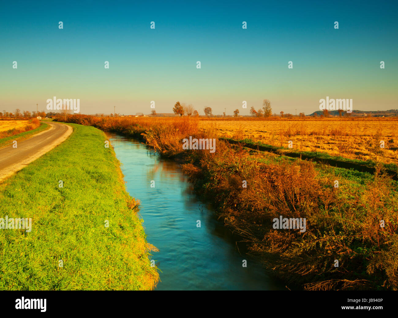 Canal under the blue sky, in country Stock Photo - Alamy