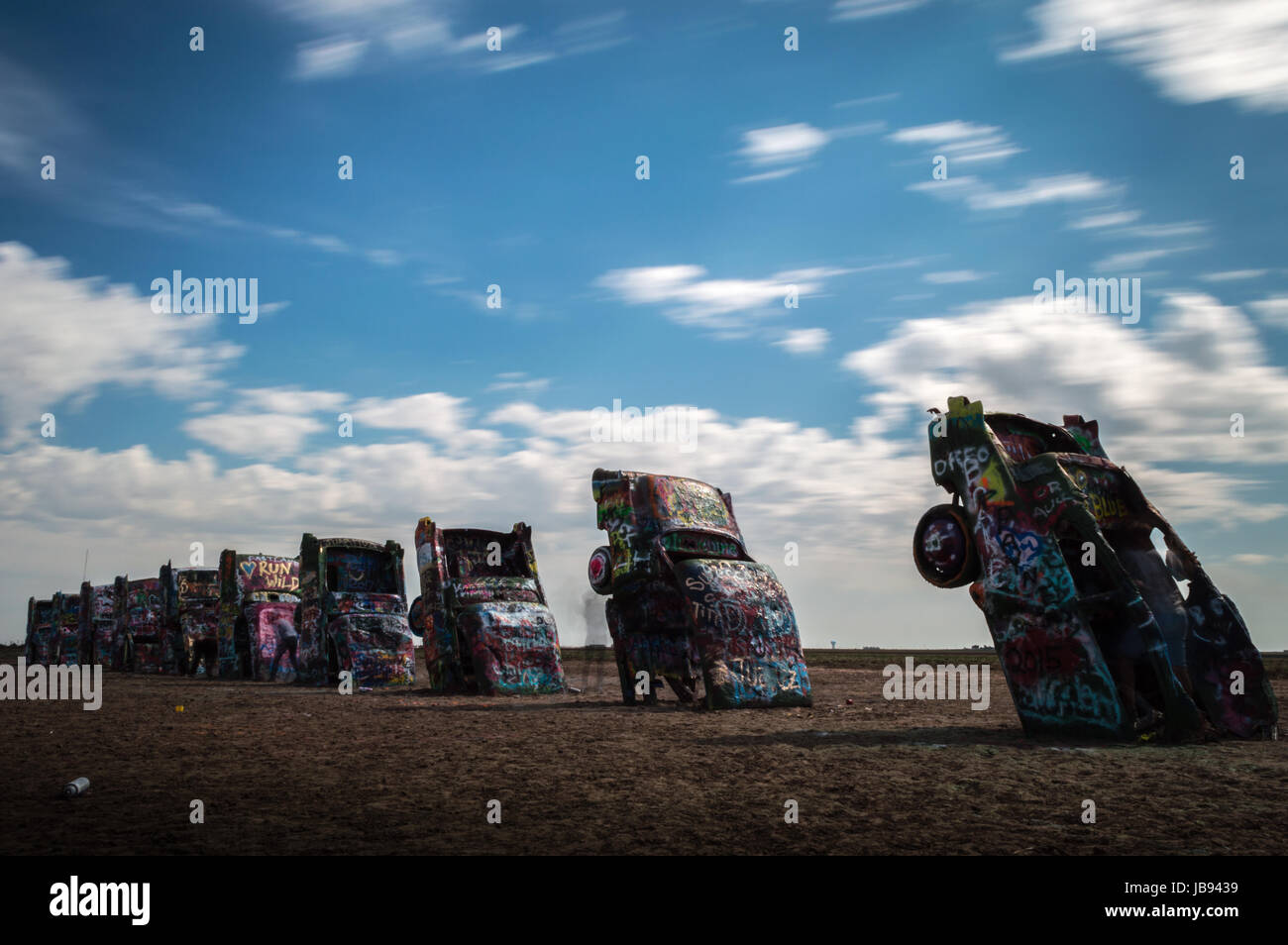 Buried cars with vibrant sky Stock Photo - Alamy
