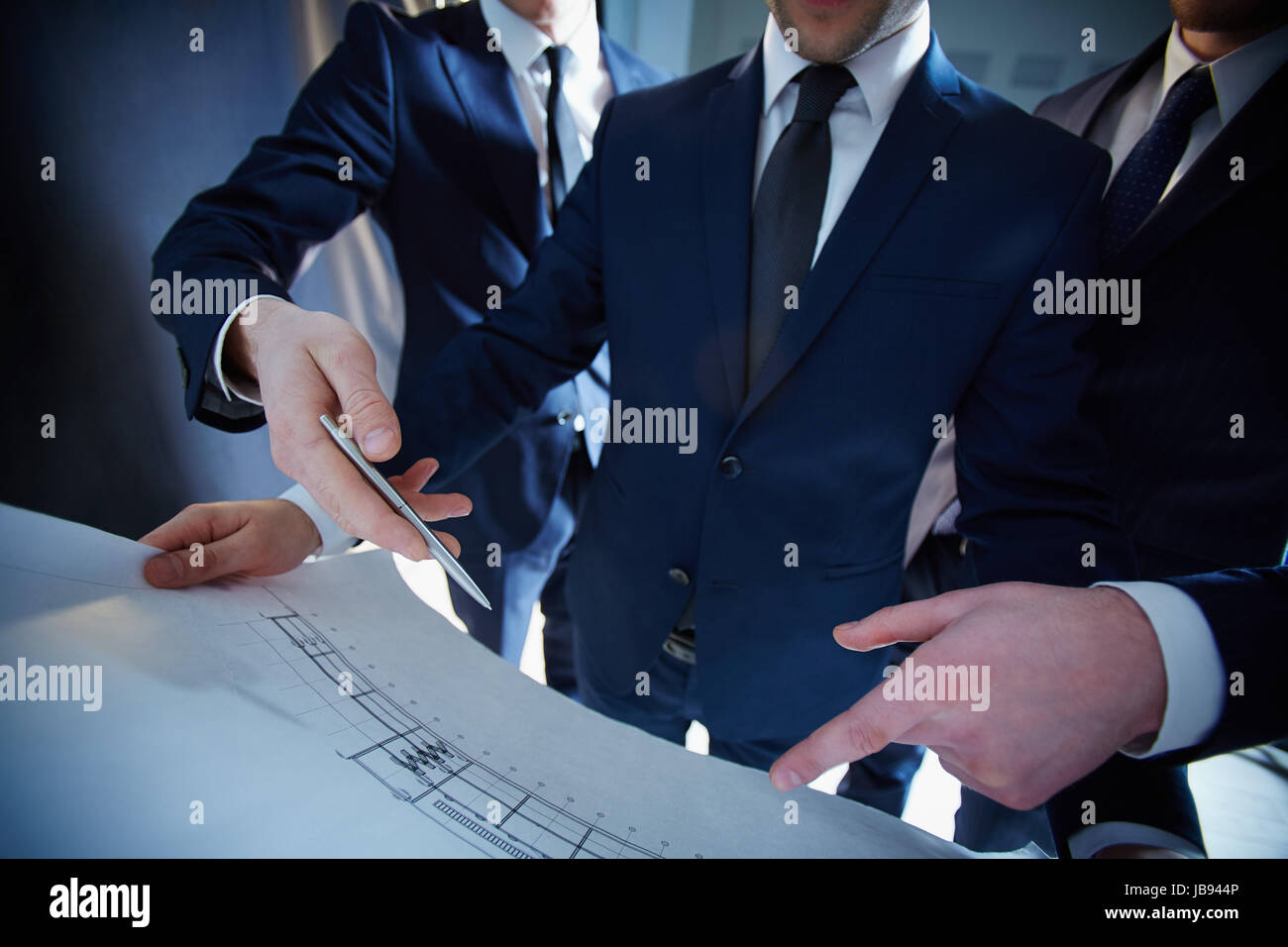 Cropped image of professional engineers working with the construction ...