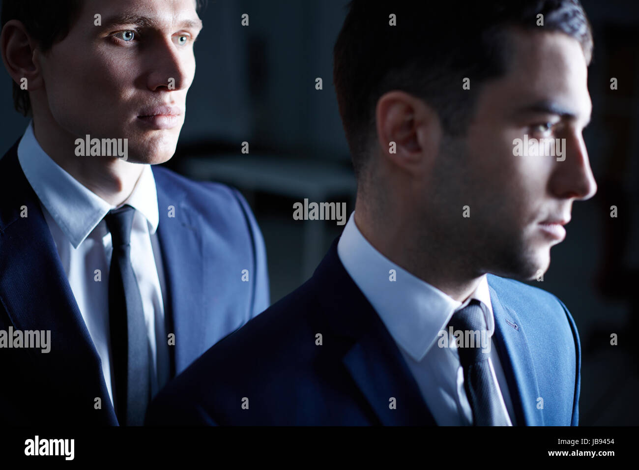 Closeup of business-minded people being concentrated at something on ...