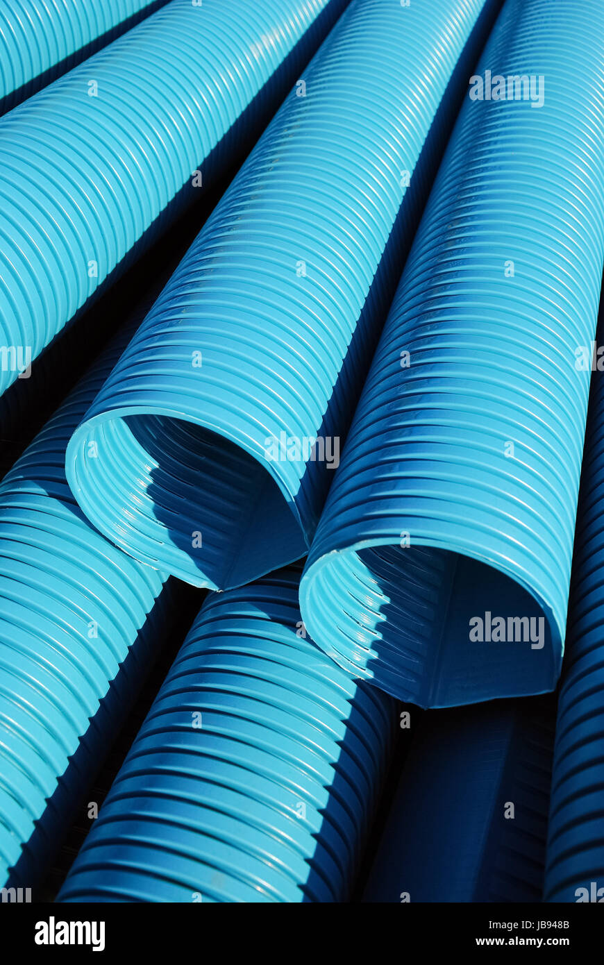 blue tubes on construction site Stock Photo - Alamy