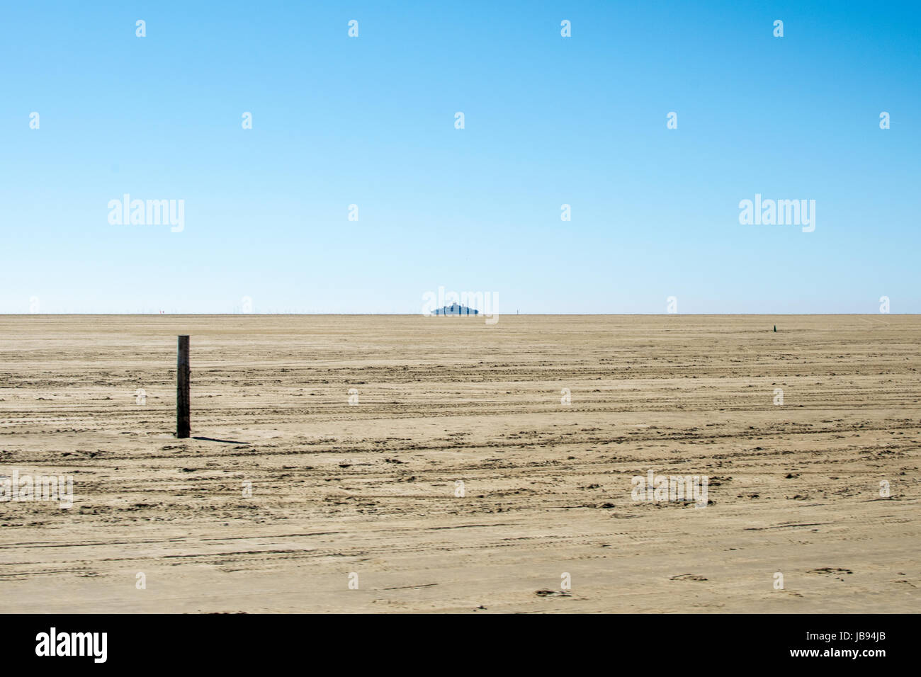 very big sand space with a blue background sky Stock Photo - Alamy