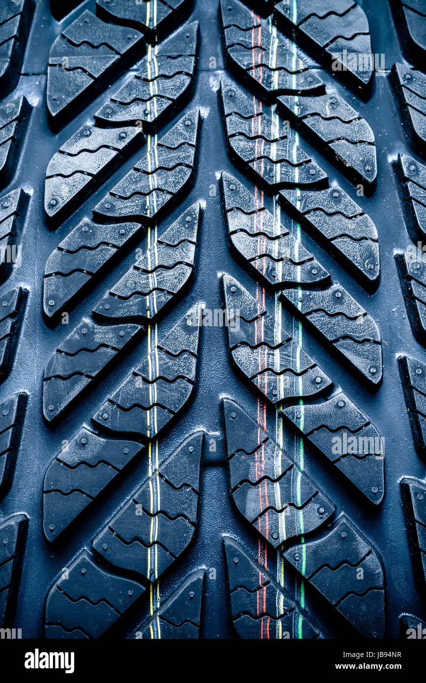 Fragment of new vehicle or car tyre, tire with visible tread and colour ...