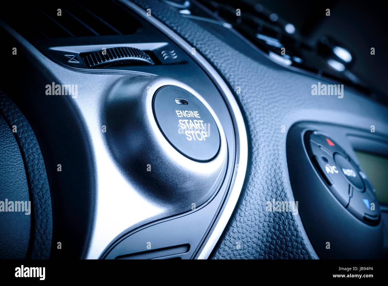 START/STOP ignition button in car, vehicle with visible fragment of ...