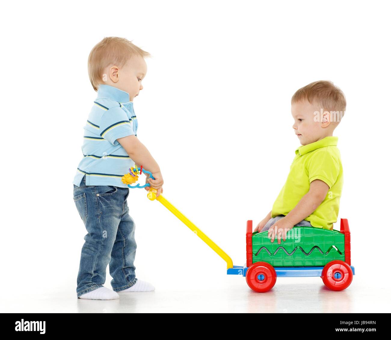 Boy pulling toy car Cut Out Stock Images & Pictures - Alamy