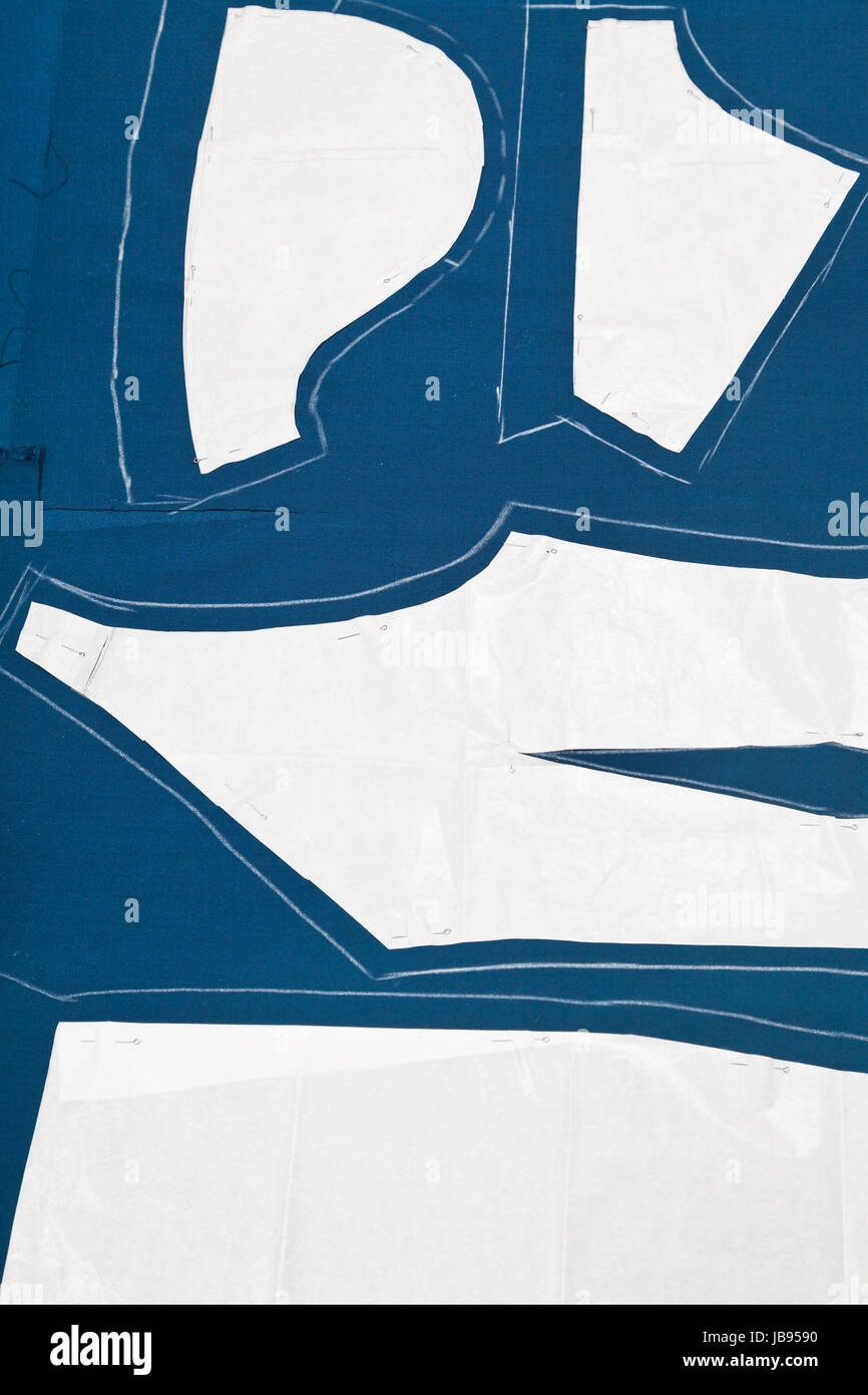 pattern and paper model of dress on blue fabric for dress cutting Stock ...