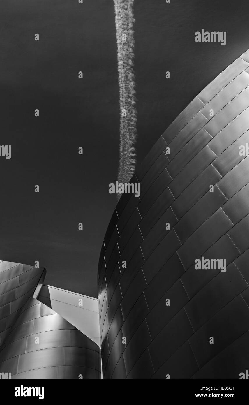 Jet stream and metal building Stock Photo - Alamy