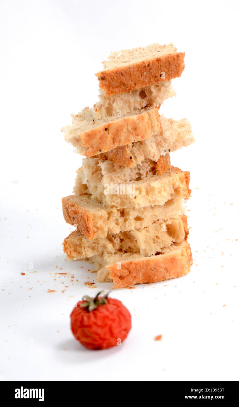 chopped bread slices and dry tomato on white background,picture of ...