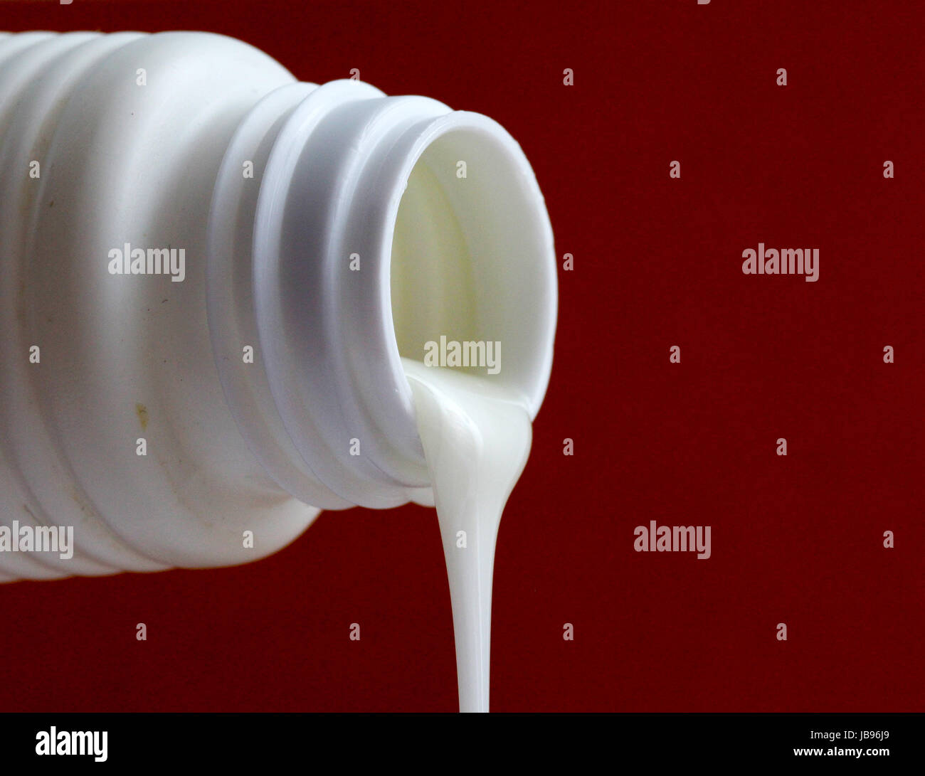 image of a Shampoo pouring out from the bottle Stock Photo - Alamy
