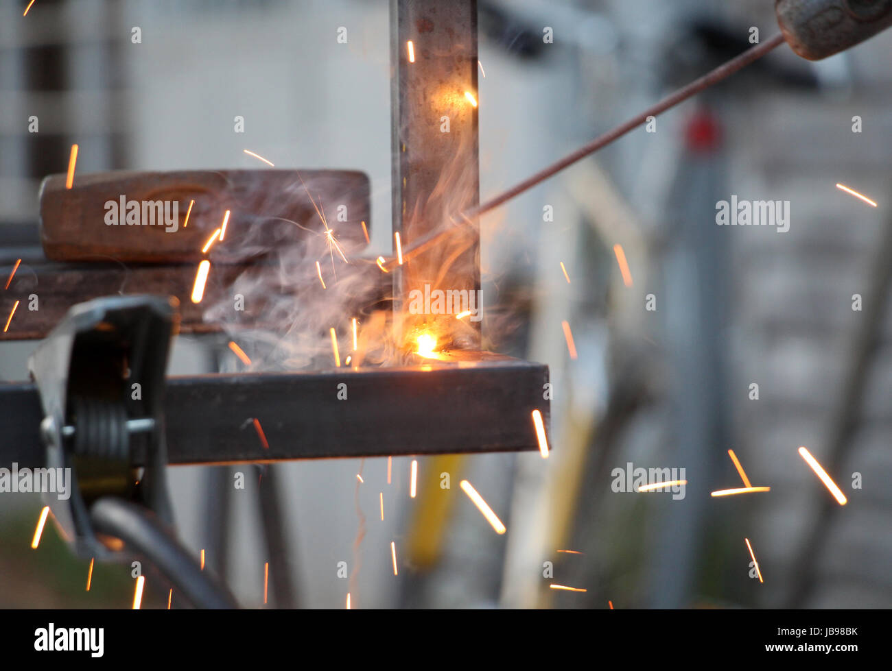 Sparks and jets of smoke when welding of steel structures,image of a ...