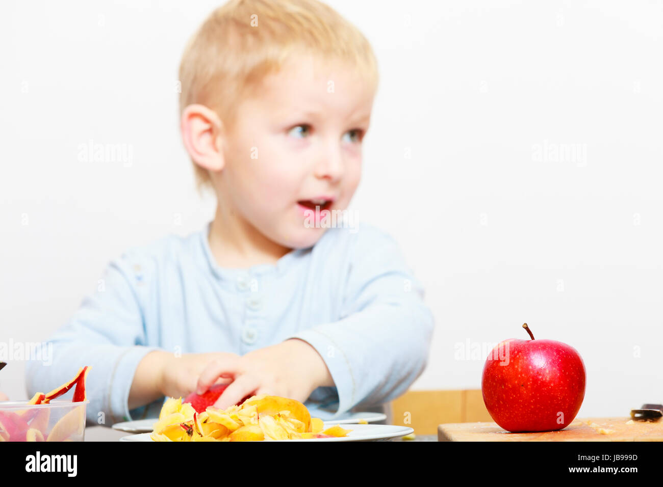 Child eating scones hi-res stock photography and images - Alamy