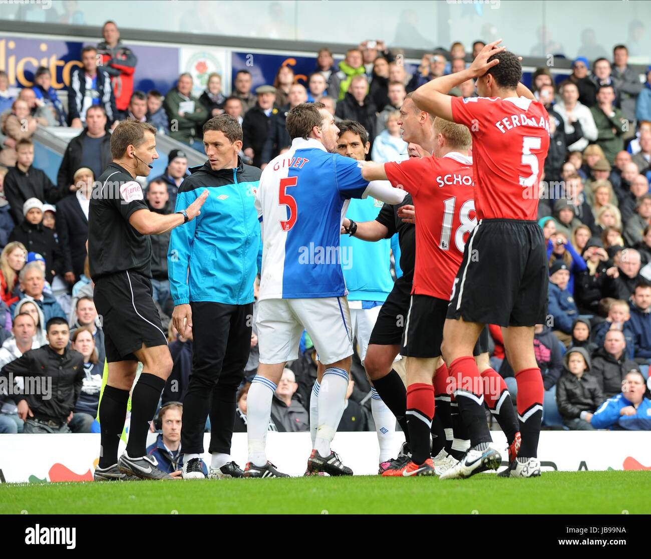 Football players surround referee hi-res stock photography and images ...