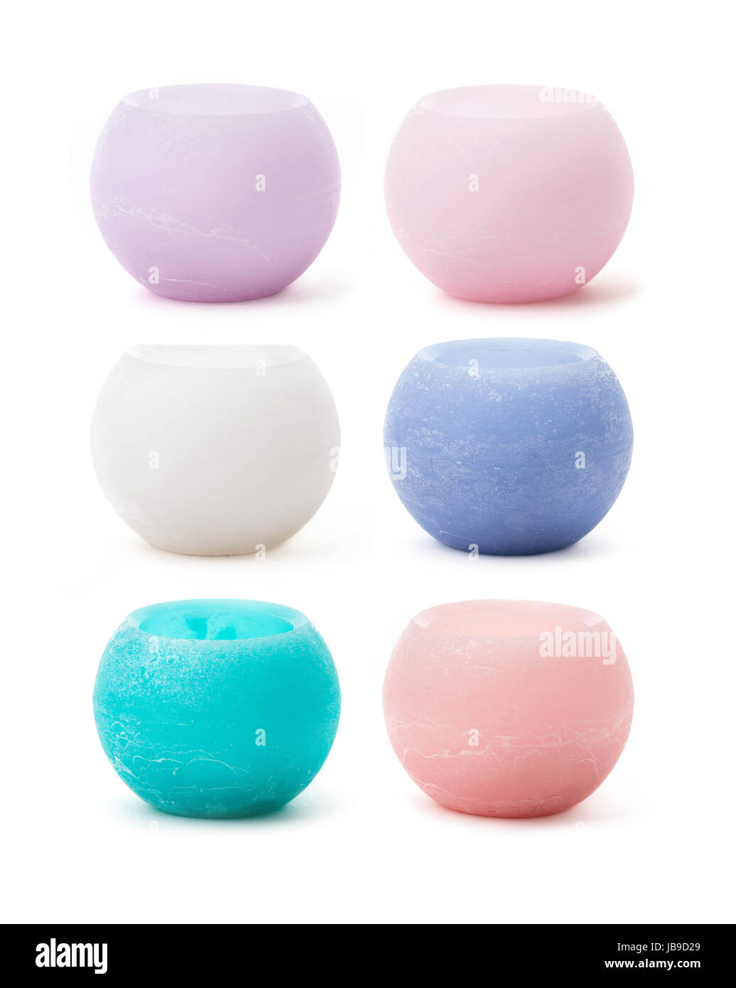 Colorful decorative ball-shaped candles over white background Stock ...