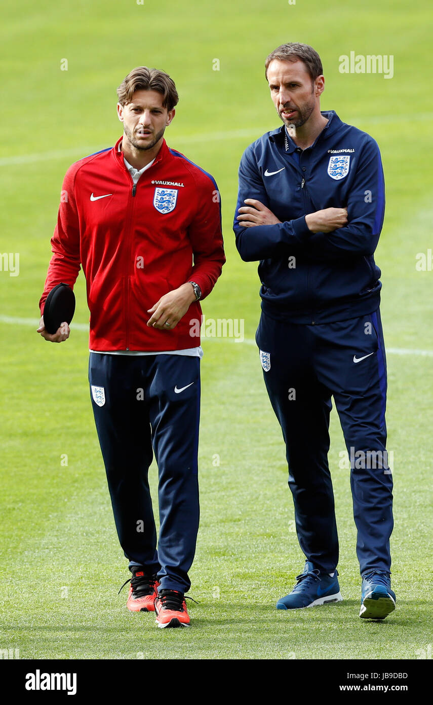 England manager Gareth Southgate (right) and Adam Lallana during a ...