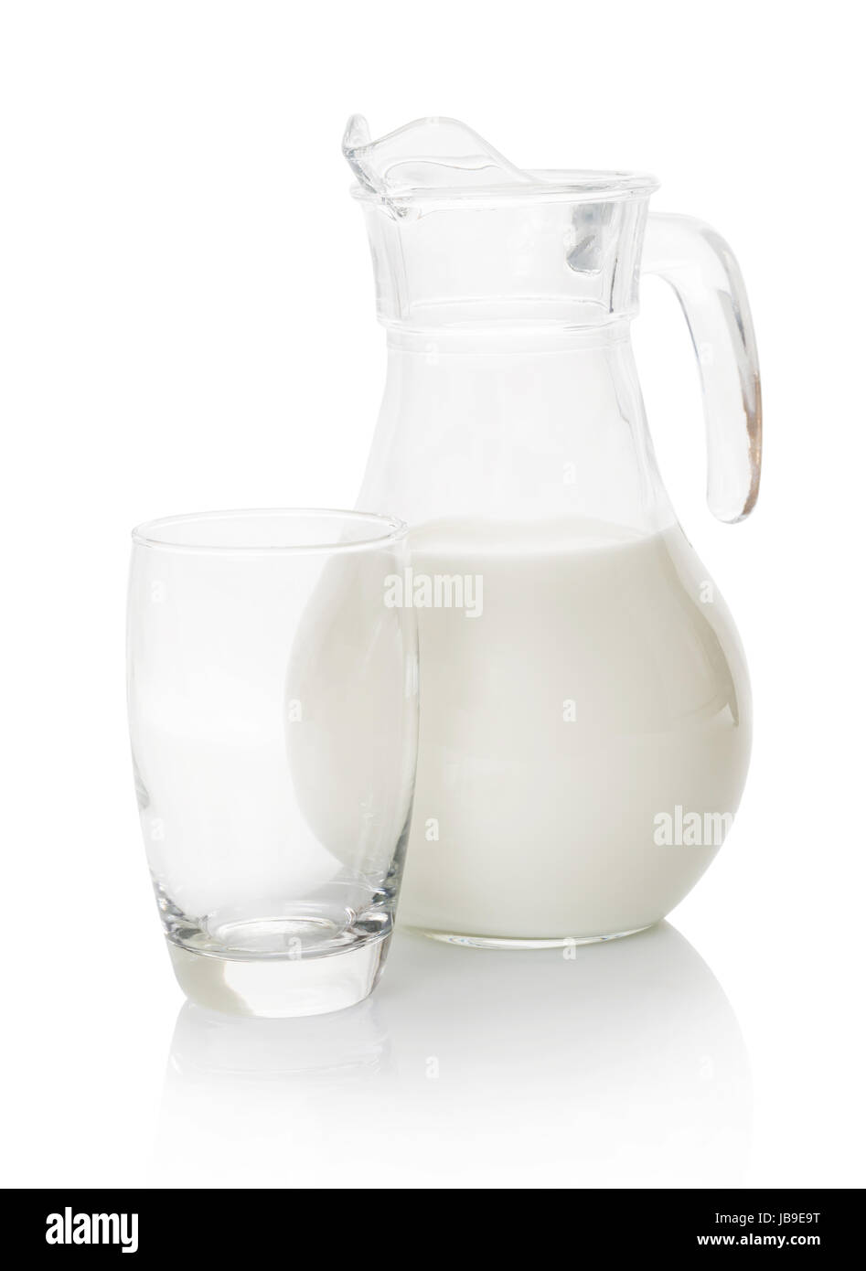 milk carafe and glass on white background Stock Photo - Alamy