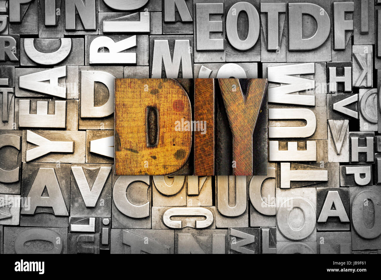 The letters DIY Do it Yourself written in vintage letterpress type ...