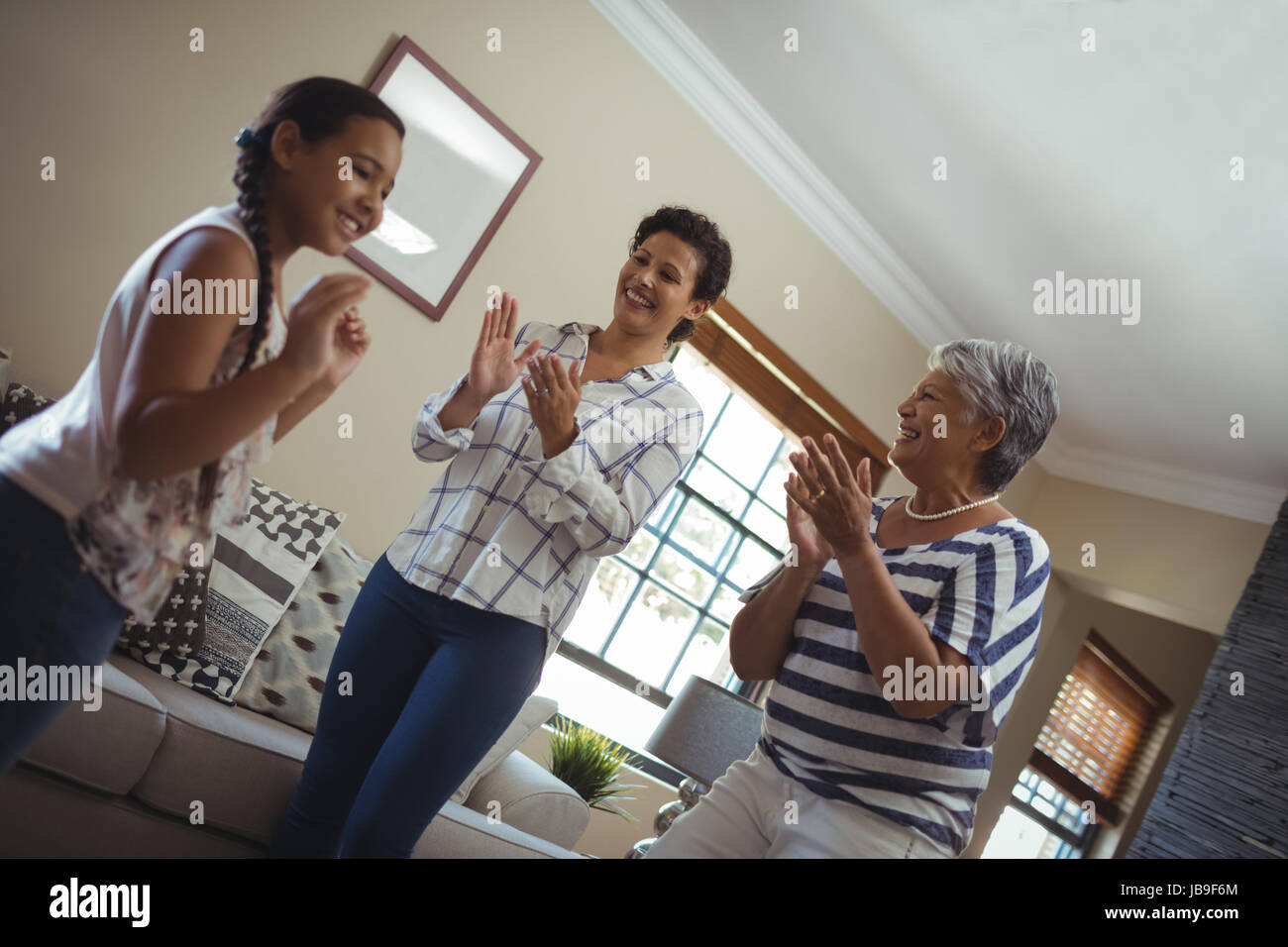 Happy family having fun in living room at home Stock Photo - Alamy