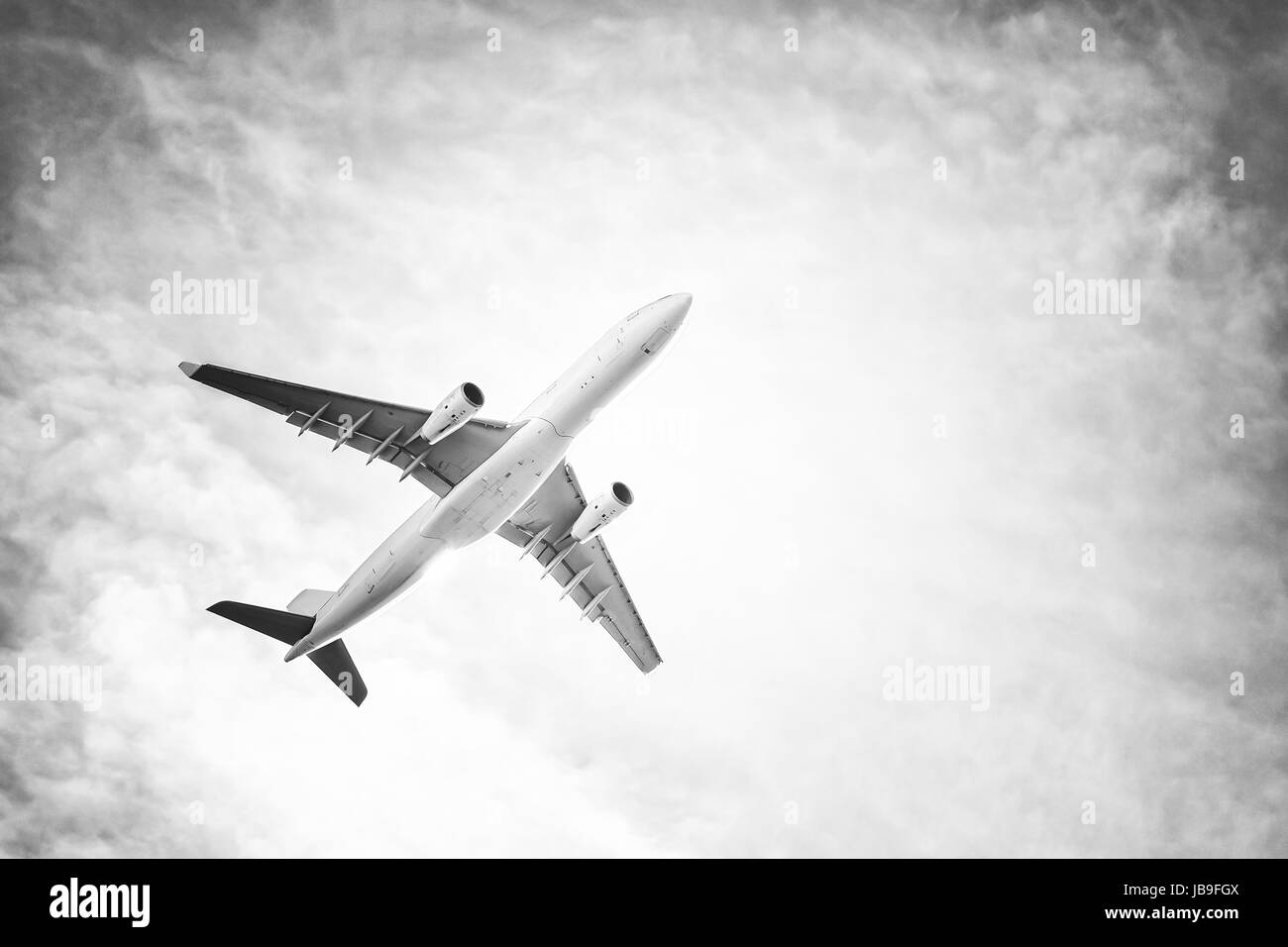 Blue sky and plane Black and White Stock Photos & Images - Alamy