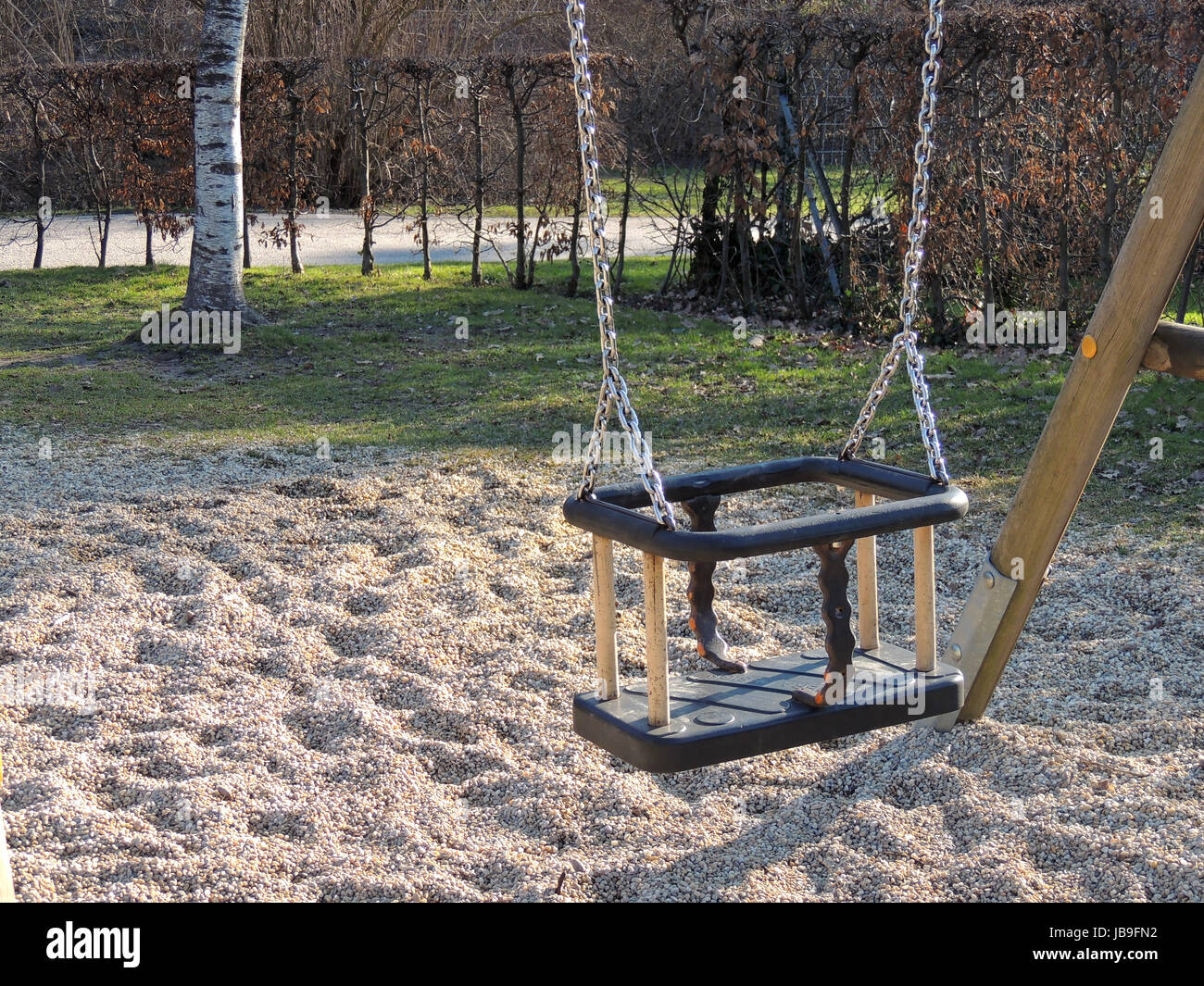 Shadow child on playground swing hi-res stock photography and images ...