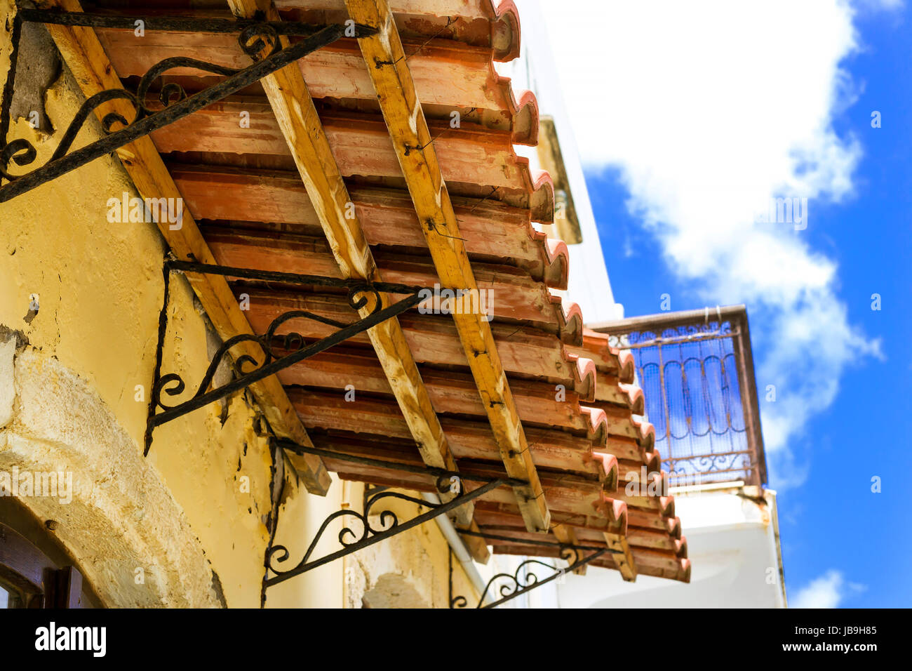Tiled canopy over the window. Resort classic Greek architecture in port ...