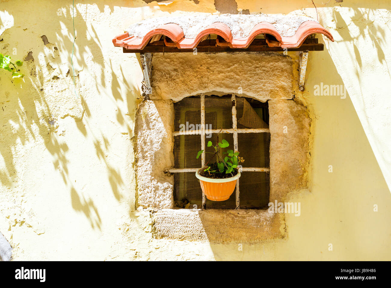 Tiled canopy over the window. Resort classic Greek architecture in port ...