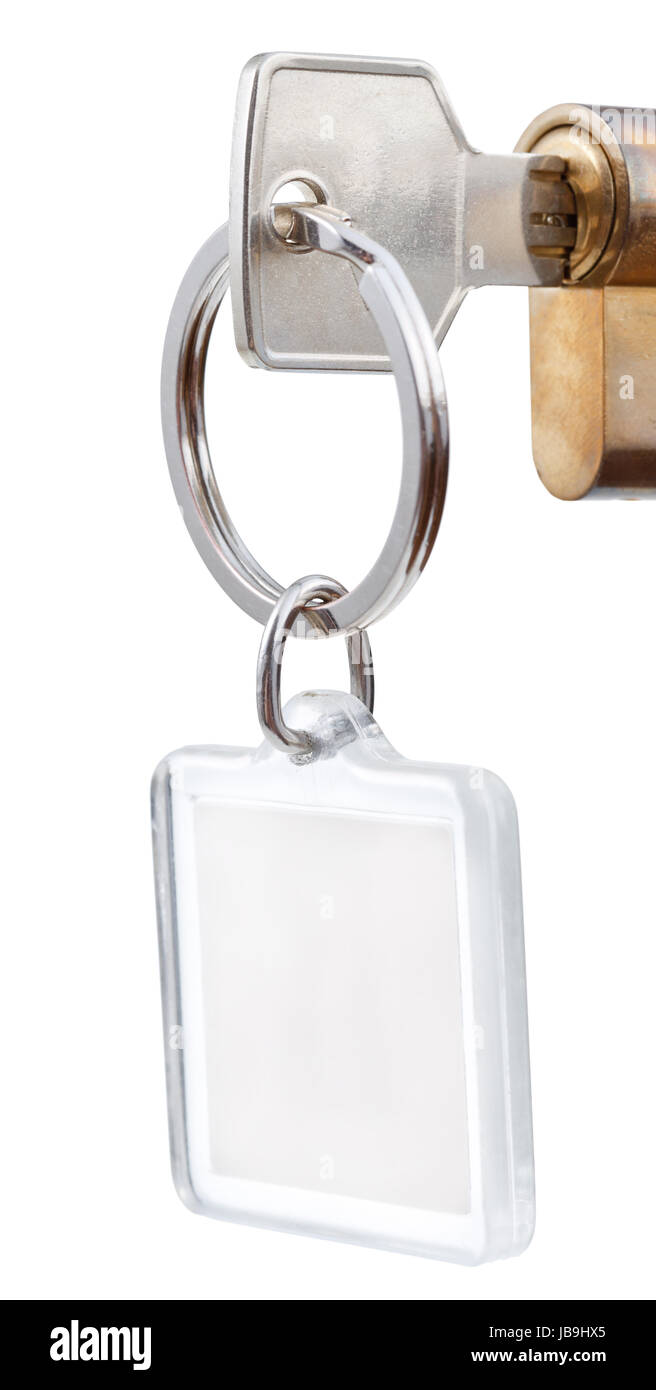 door key with square keychain in cylinder lock close up isolated on ...