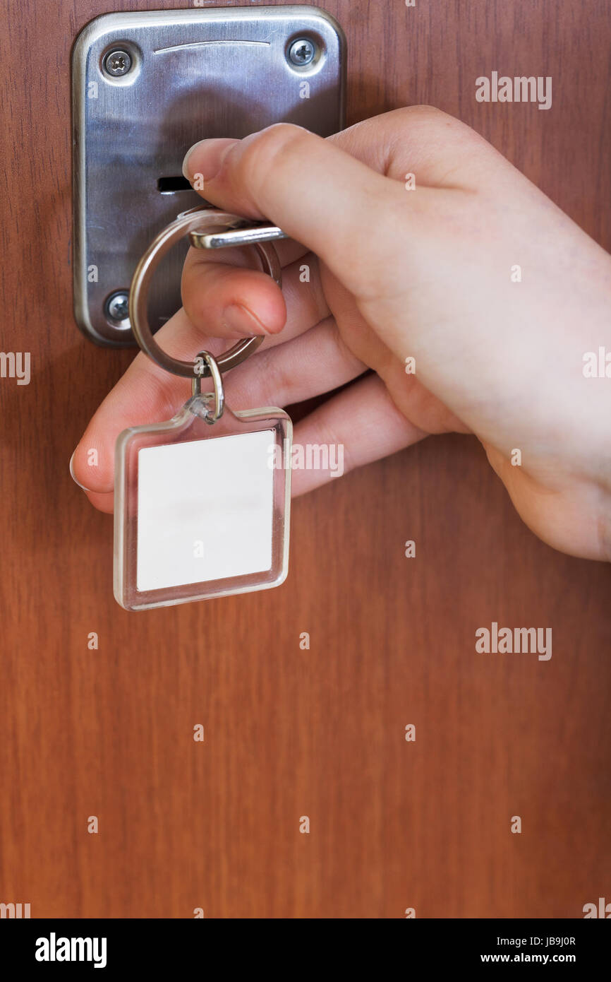 Hand closing house entrance wooden door hi-res stock photography and ...