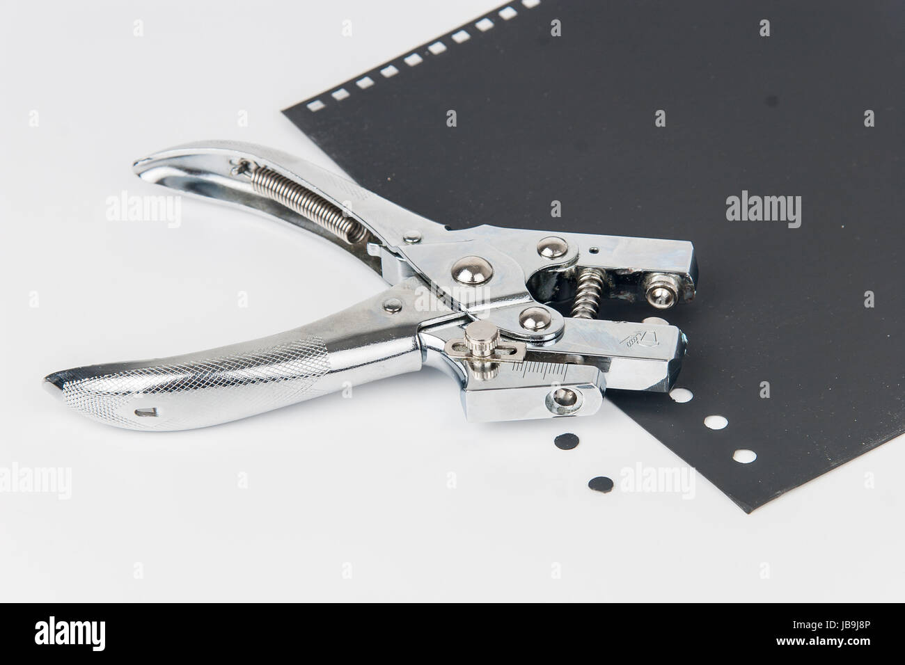 Office Puncher Unit isolated on white background Stock Photo - Alamy